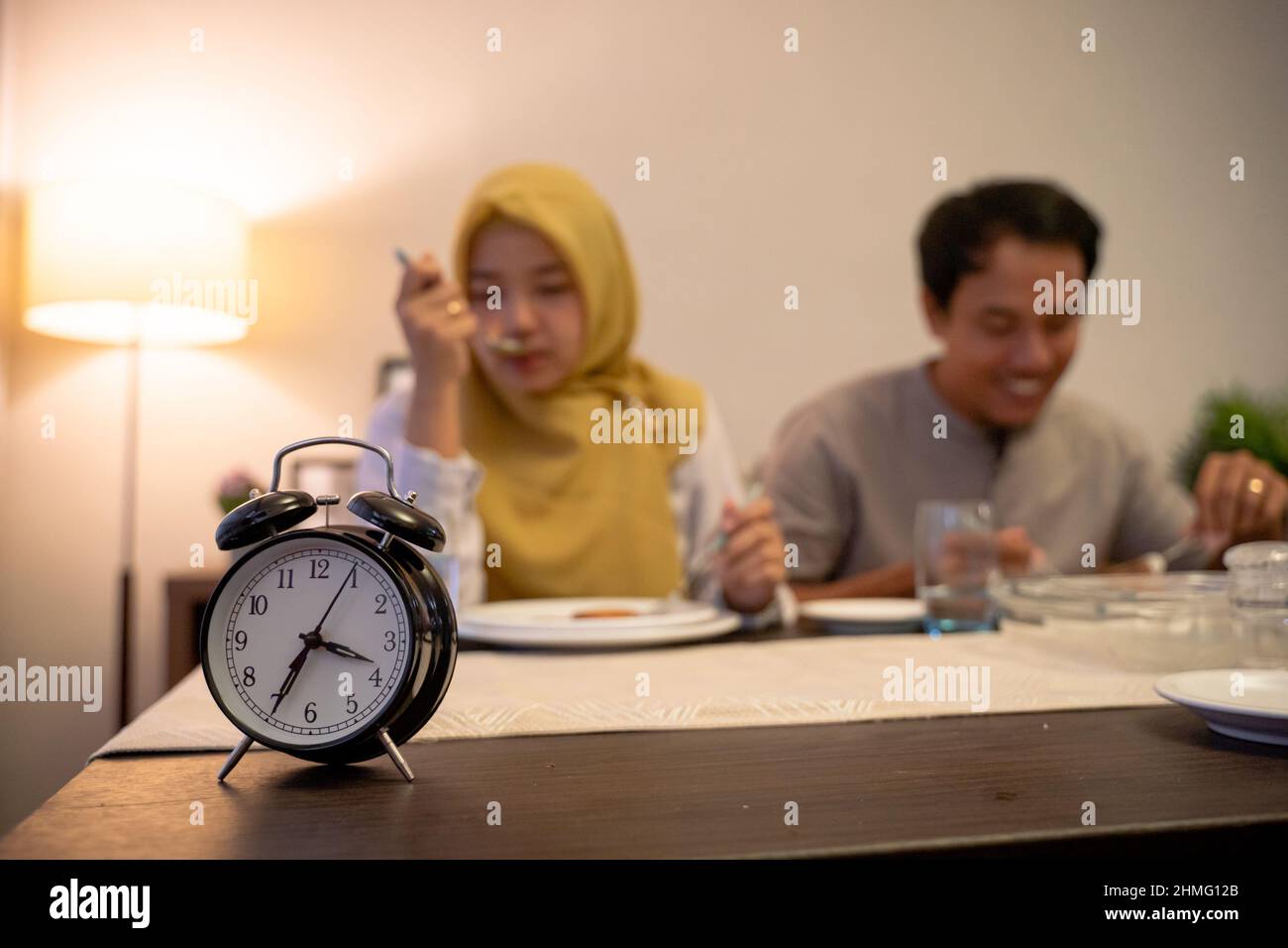 Muslim family having breakfast at home hi-res stock photography and ...