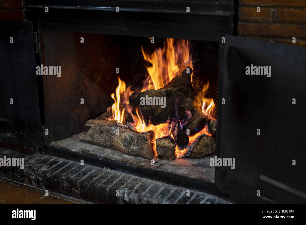 Scenic view of a fireplace with burning wood in a house Stock Photo - Alamy