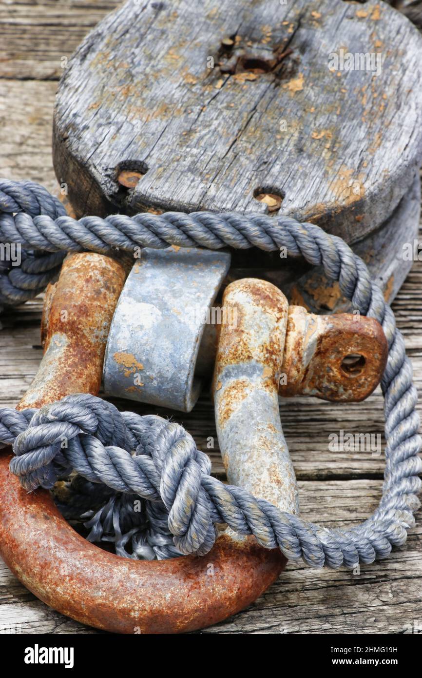 Rope around a rusty knot in a port Stock Photo - Alamy
