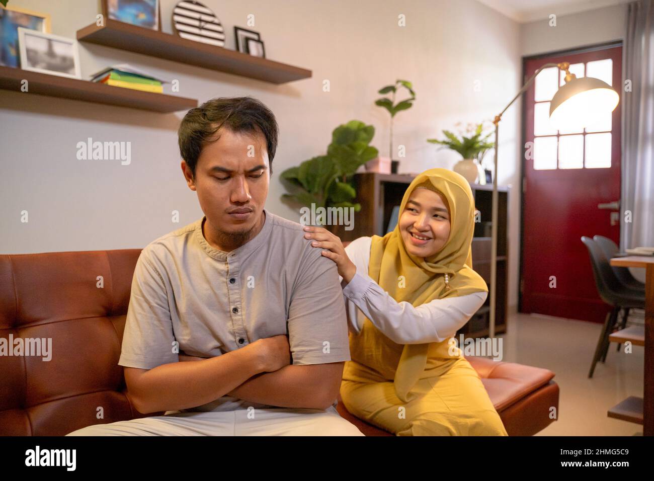 muslim woman begging her husband to forgive her Stock Photo - Alamy