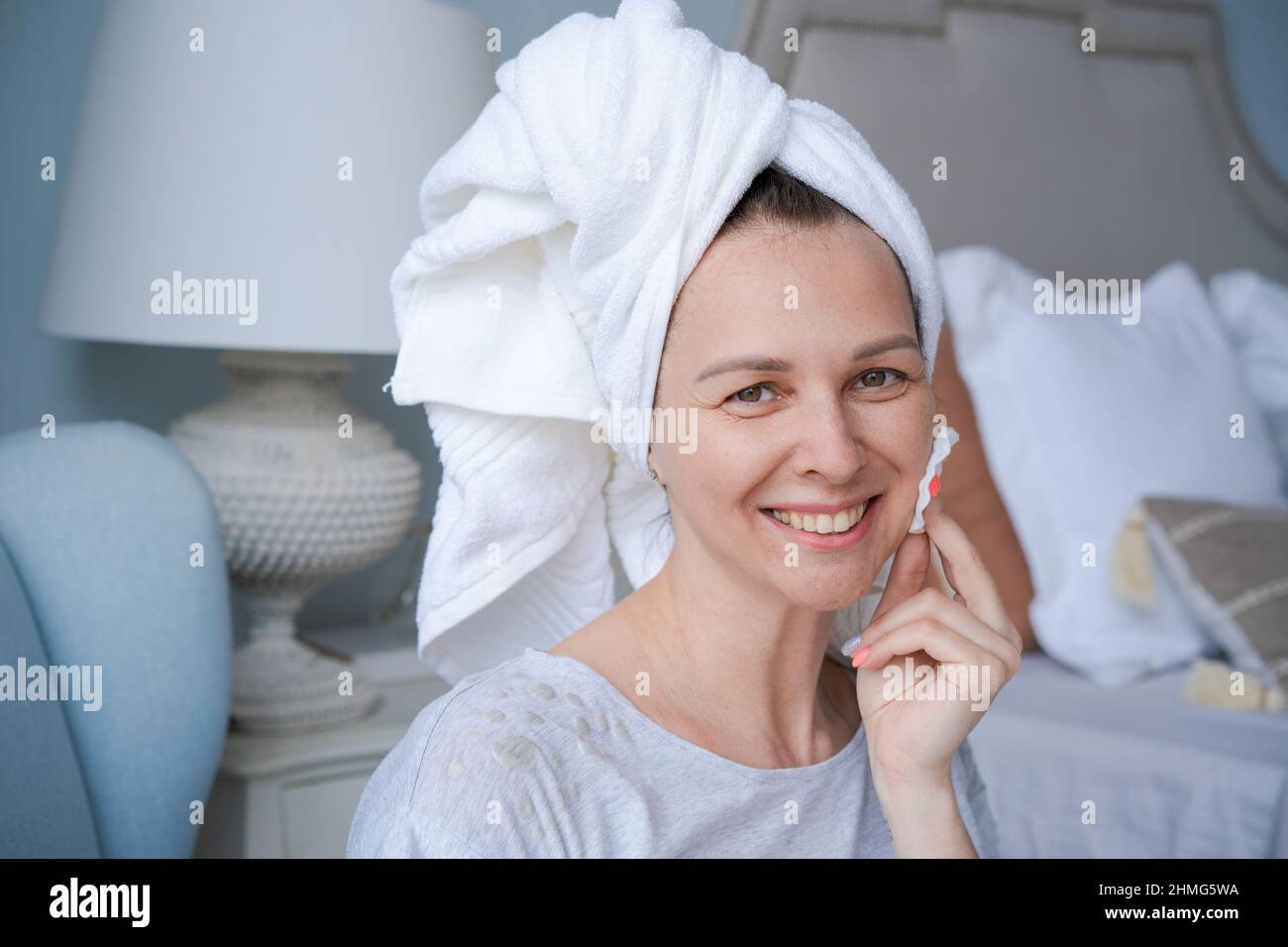 Close-up 35 year old woman taking care clean skin and pores after ...
