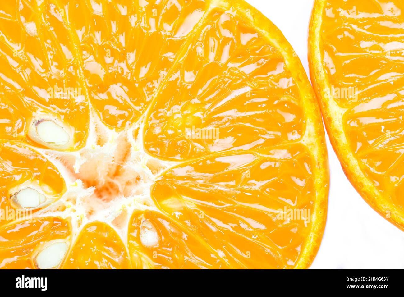 Orange slice (half) isolated on white background Stock Photo - Alamy