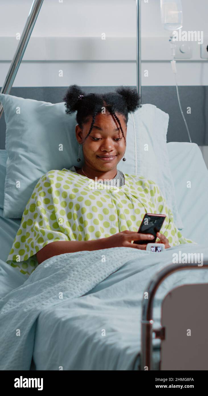 Patient with disease using smartphone to text messages and browse ...