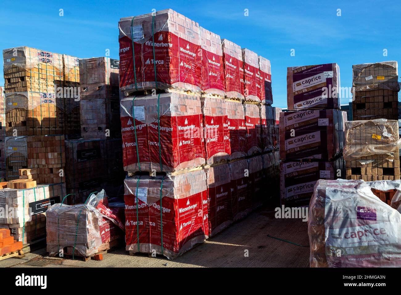 Piles of bricks in Jewson builders merchant yard, Martlesham, Suffolk ...