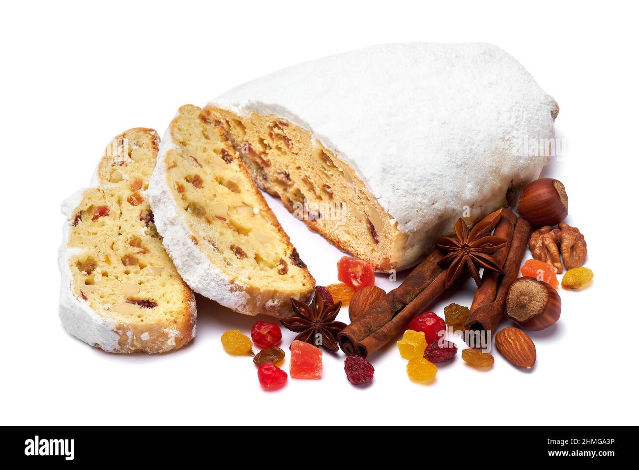 Sliced Traditional Christmas stollen cake with marzipan and dried fruit ...