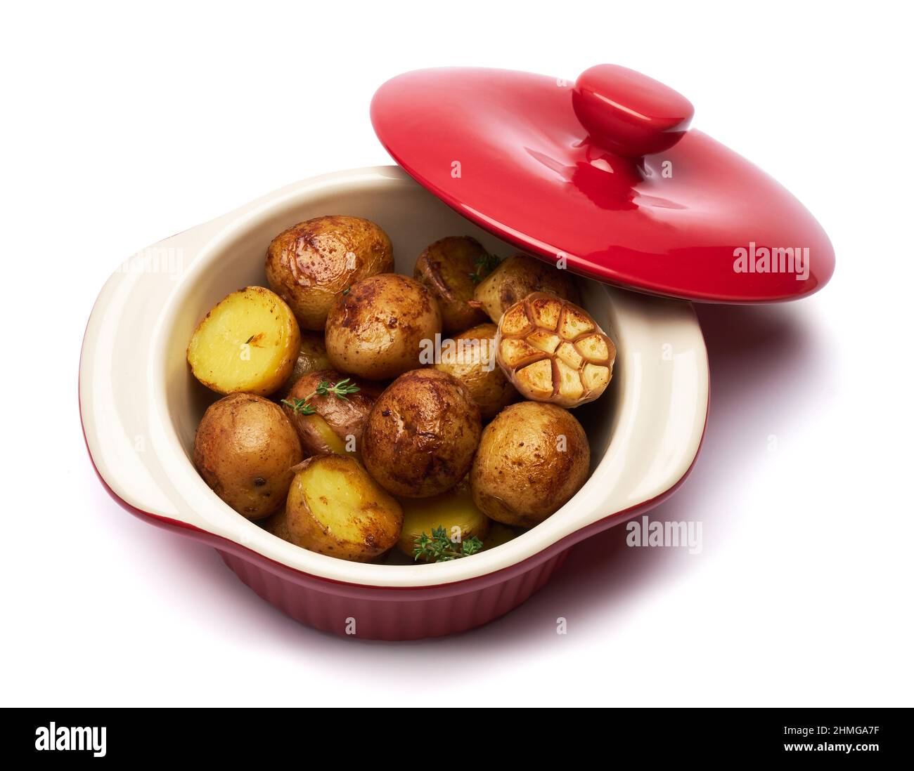 Baked potato in a clay pot isolated on white background Stock Photo - Alamy