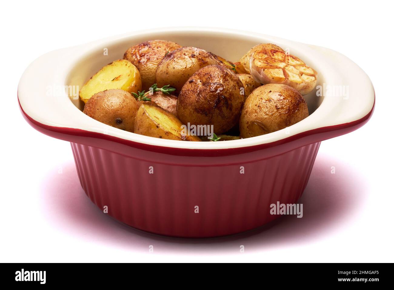 Baked potato in a clay pot isolated on white background Stock Photo - Alamy