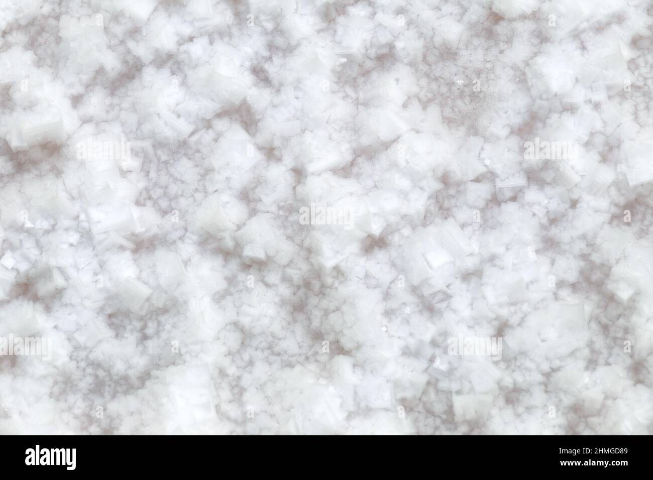 Sea salt mining, produced from the evaporation of seawater, close up ...