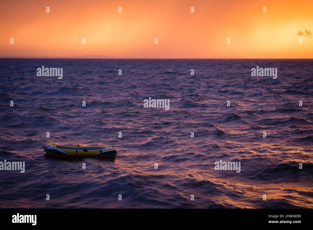 Sunset at sea during storm and rain Stock Photo - Alamy