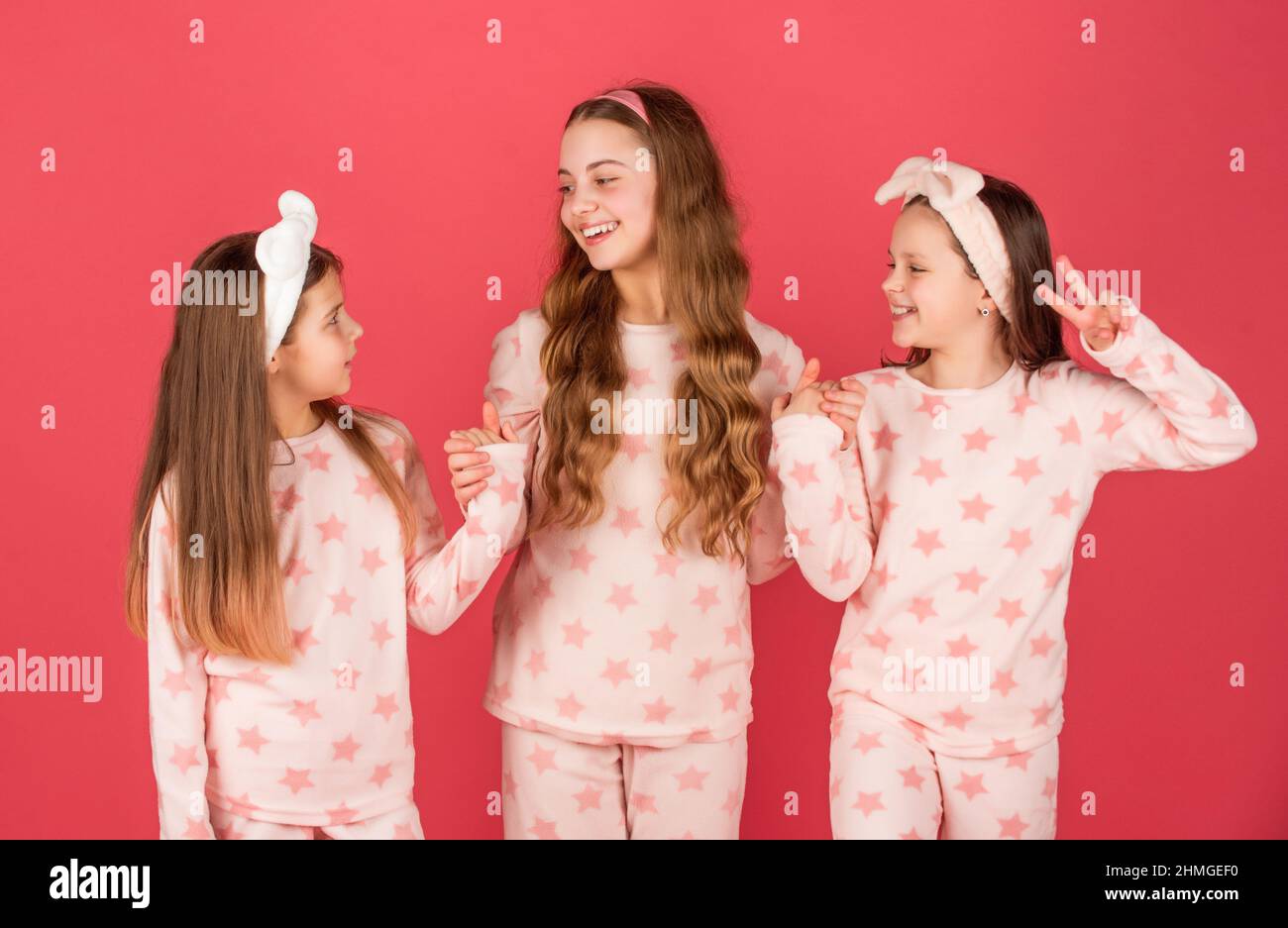 Homewear and pyjamas for girls. Happy kids in homewear. Holding hands ...