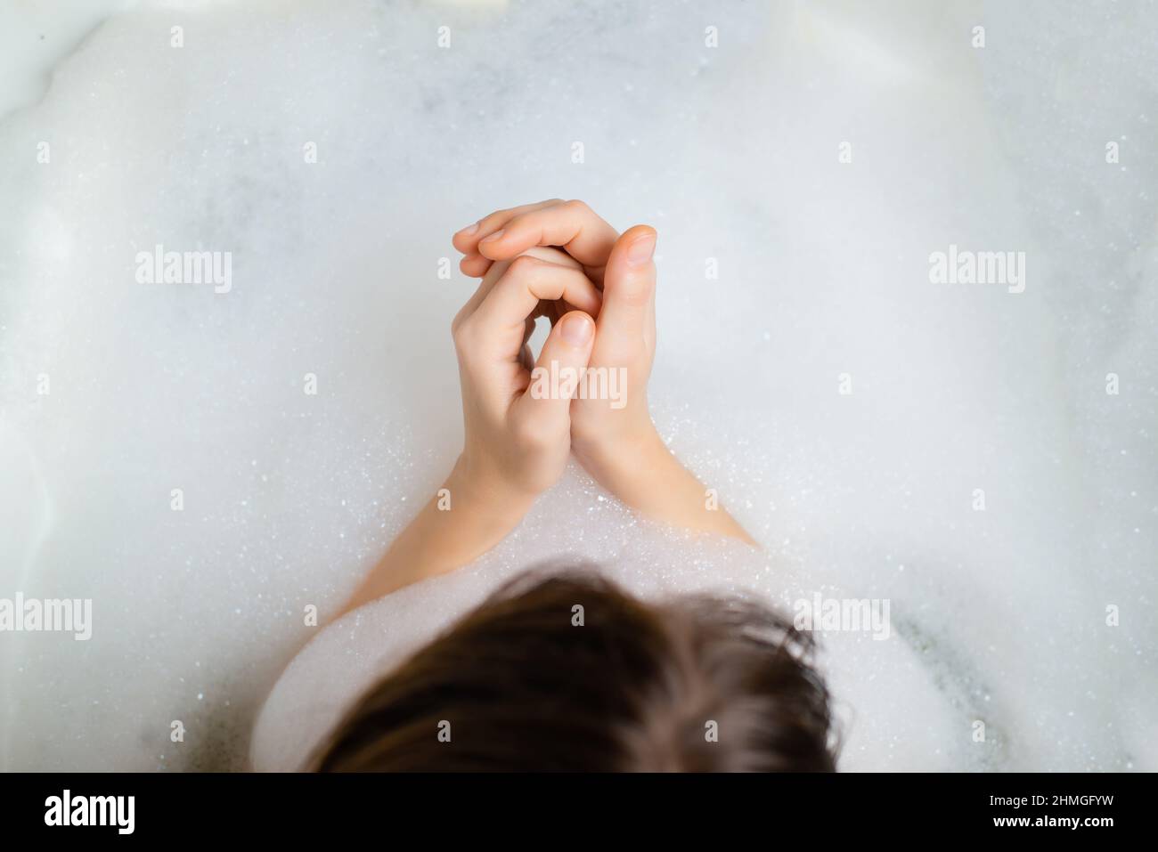 Relaxation, reflection, thoughtfulness in a bubble bath concept. Women ...