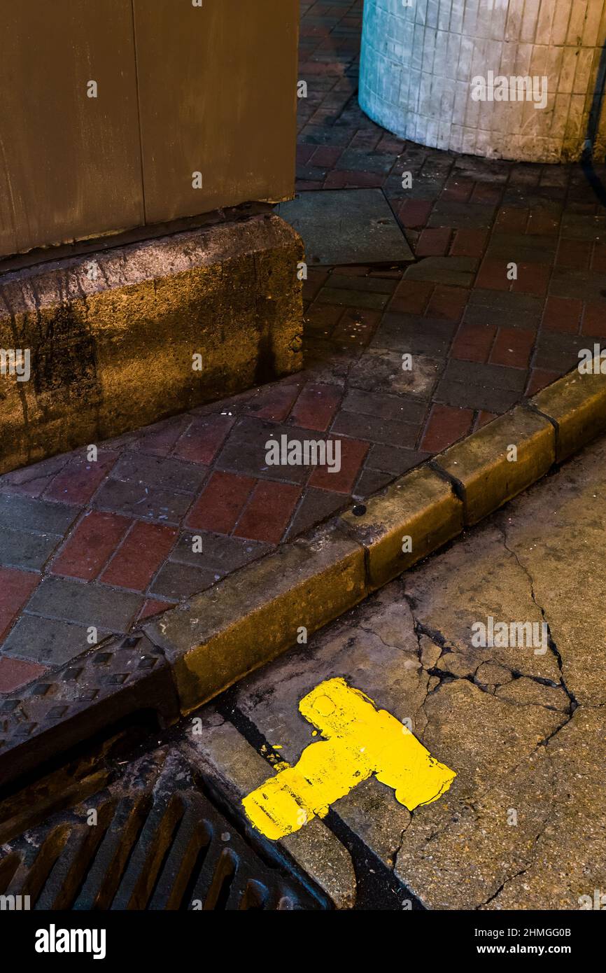 A graphic close-up of road markings and footpath below Canal Road ...