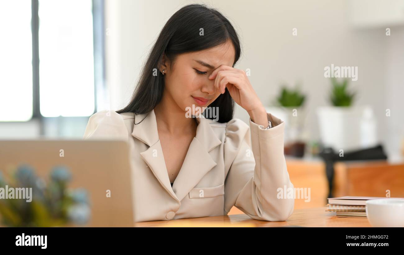 Asian Female or businesswoman crying over her failure and unsuccessful ...