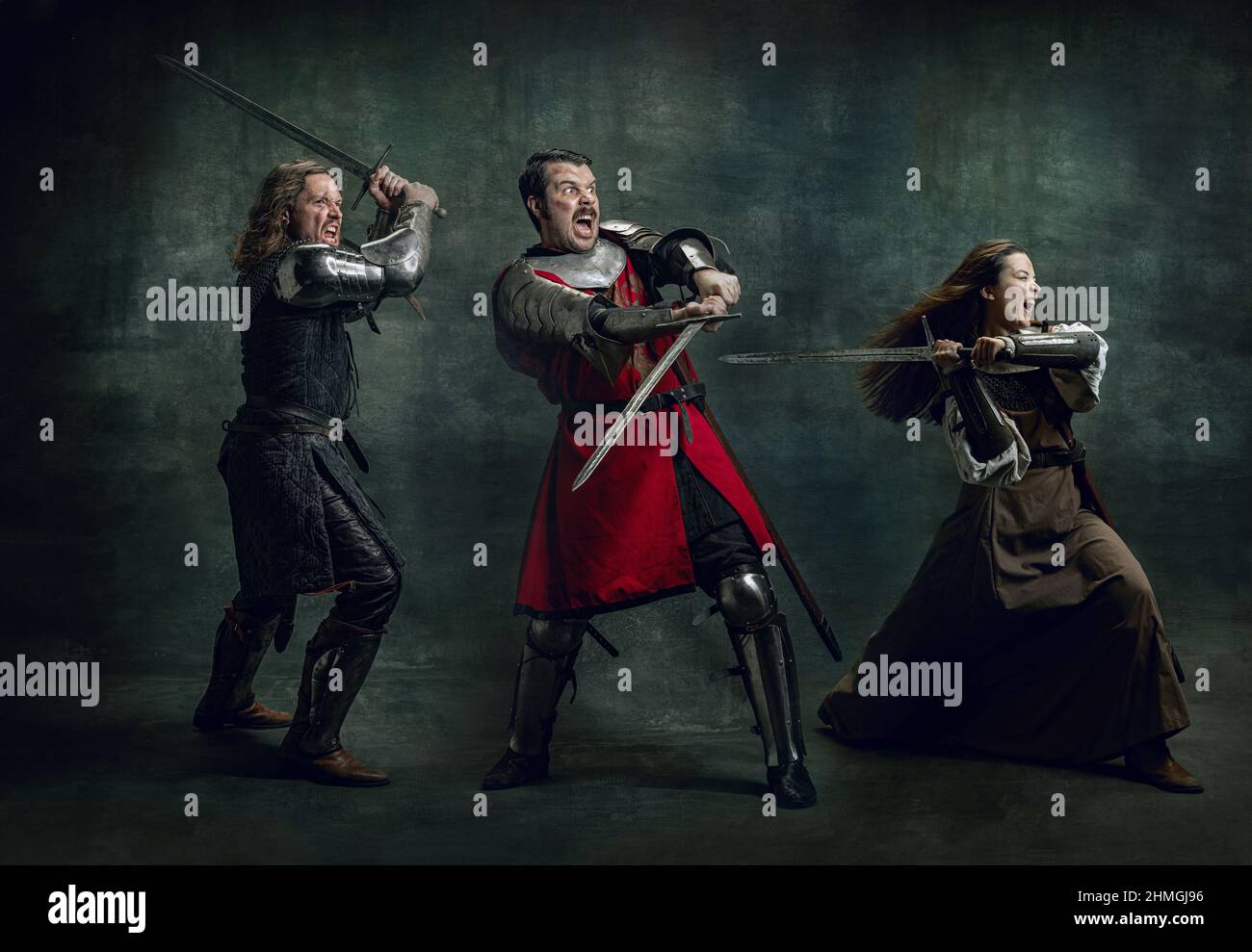 In action. Creative art collage with brutal serious medieval warriors ...