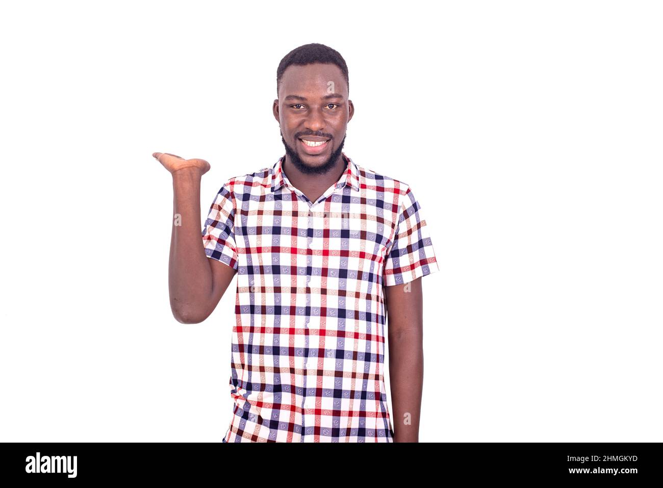 handsome adult serious man raising palm up to one side and showing ...