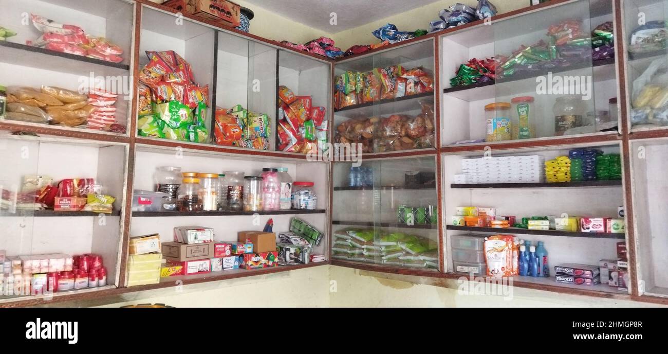 Products on shelves in store. Inside view of general Store Stock Photo ...