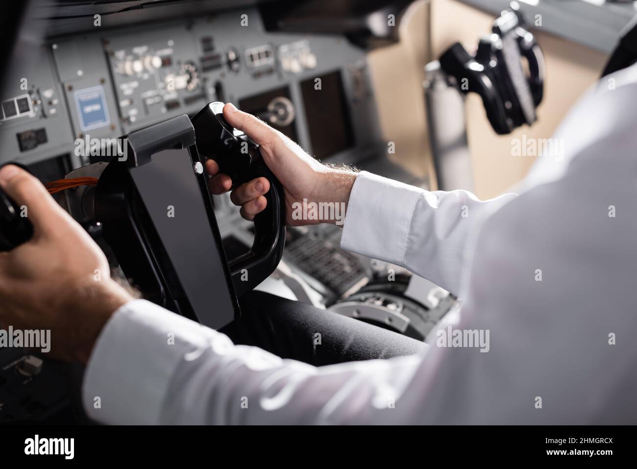 partial view of pilot using yoke in airplane simulator Stock Photo - Alamy