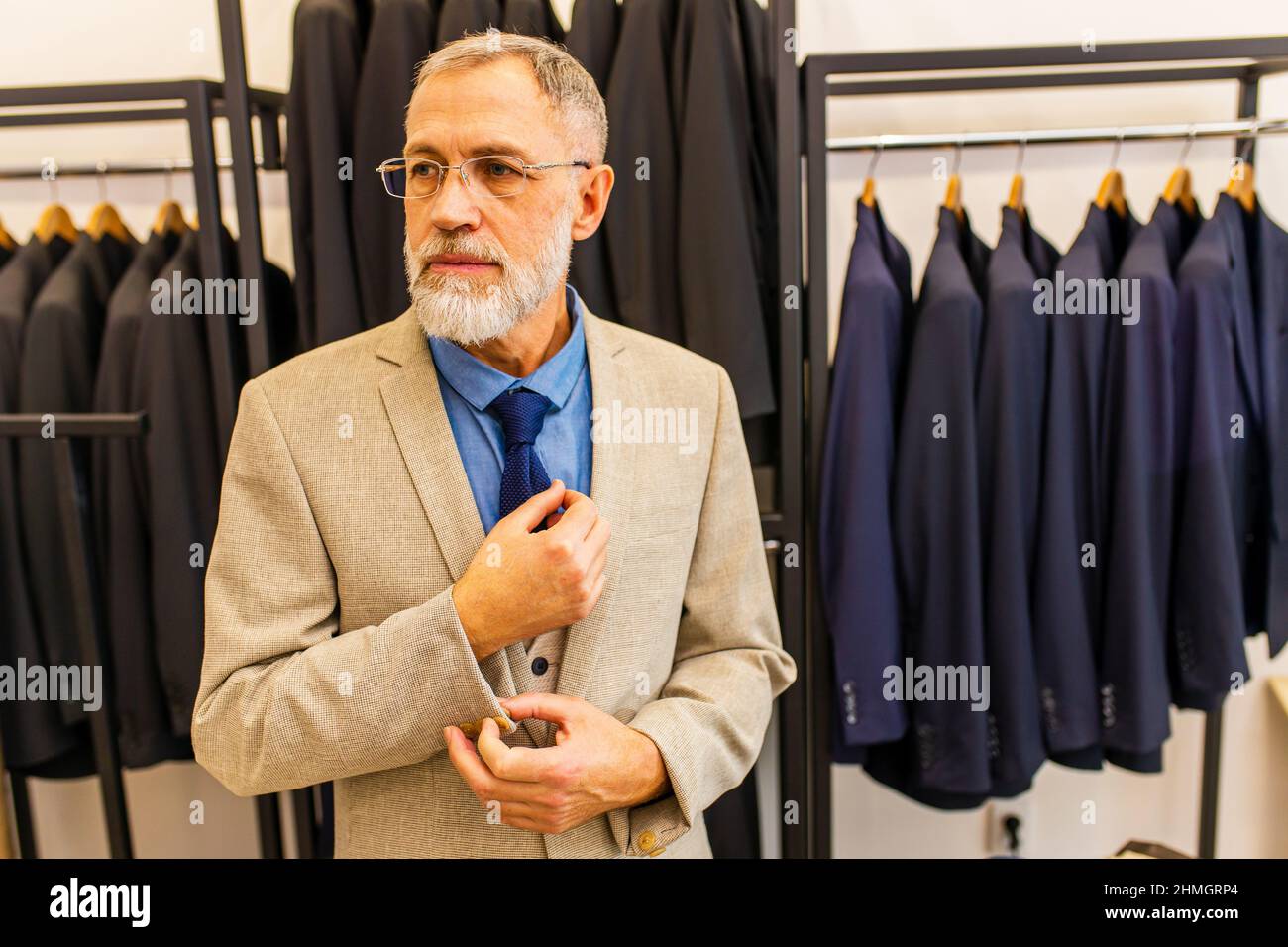 elderly good looking man in stylish and rich suit owner of atelier ...
