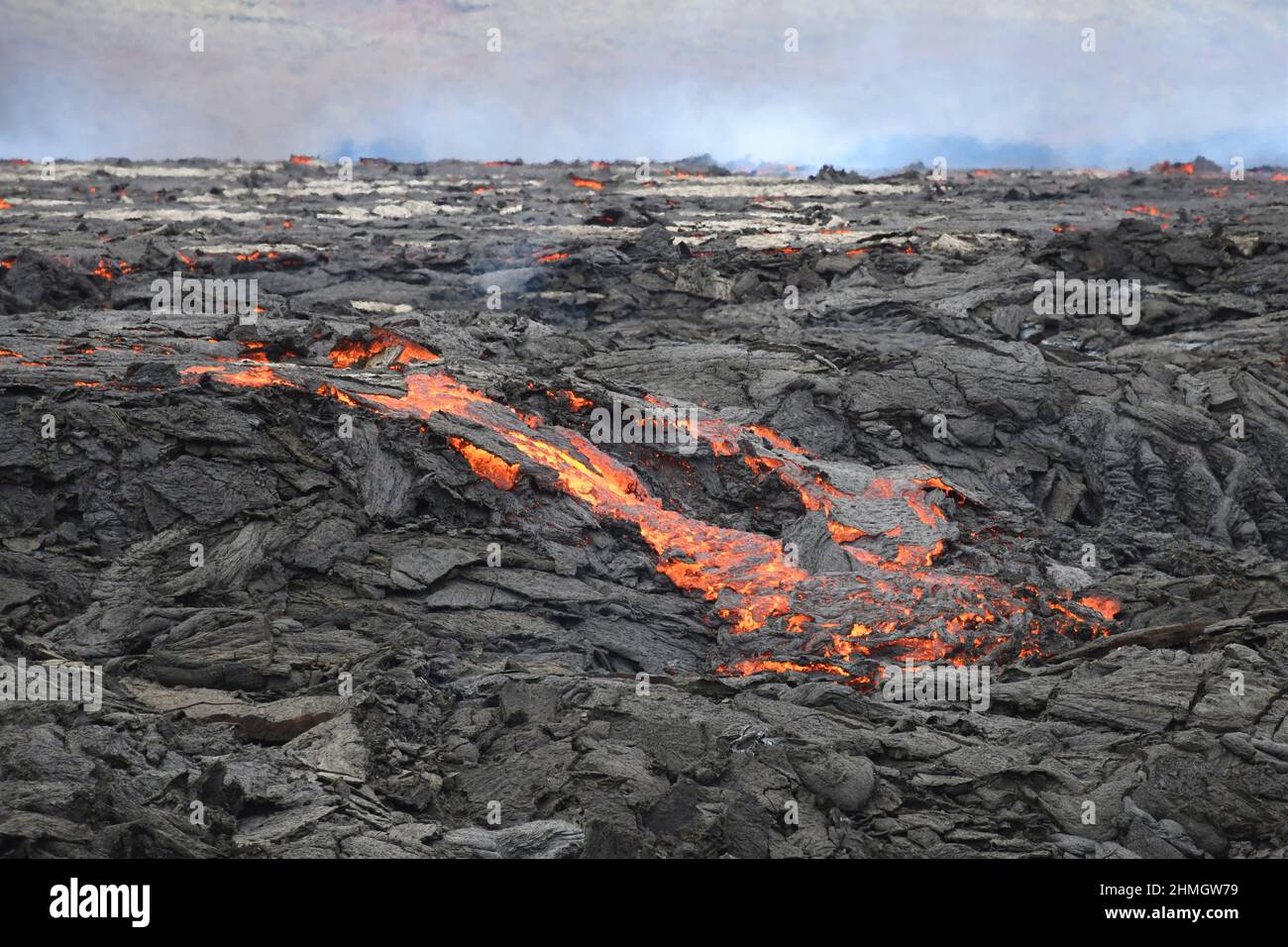 Molten lava flow at Fagradalsfjall, Iceland. Red and orange lava flows ...