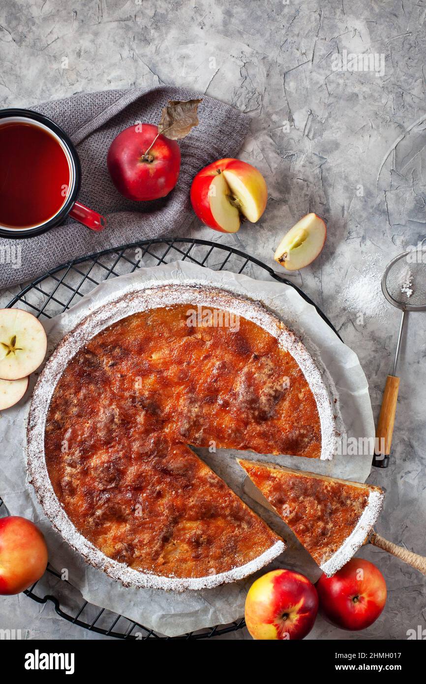 Homemade delicious apple pie, top view, gray background Stock Photo - Alamy