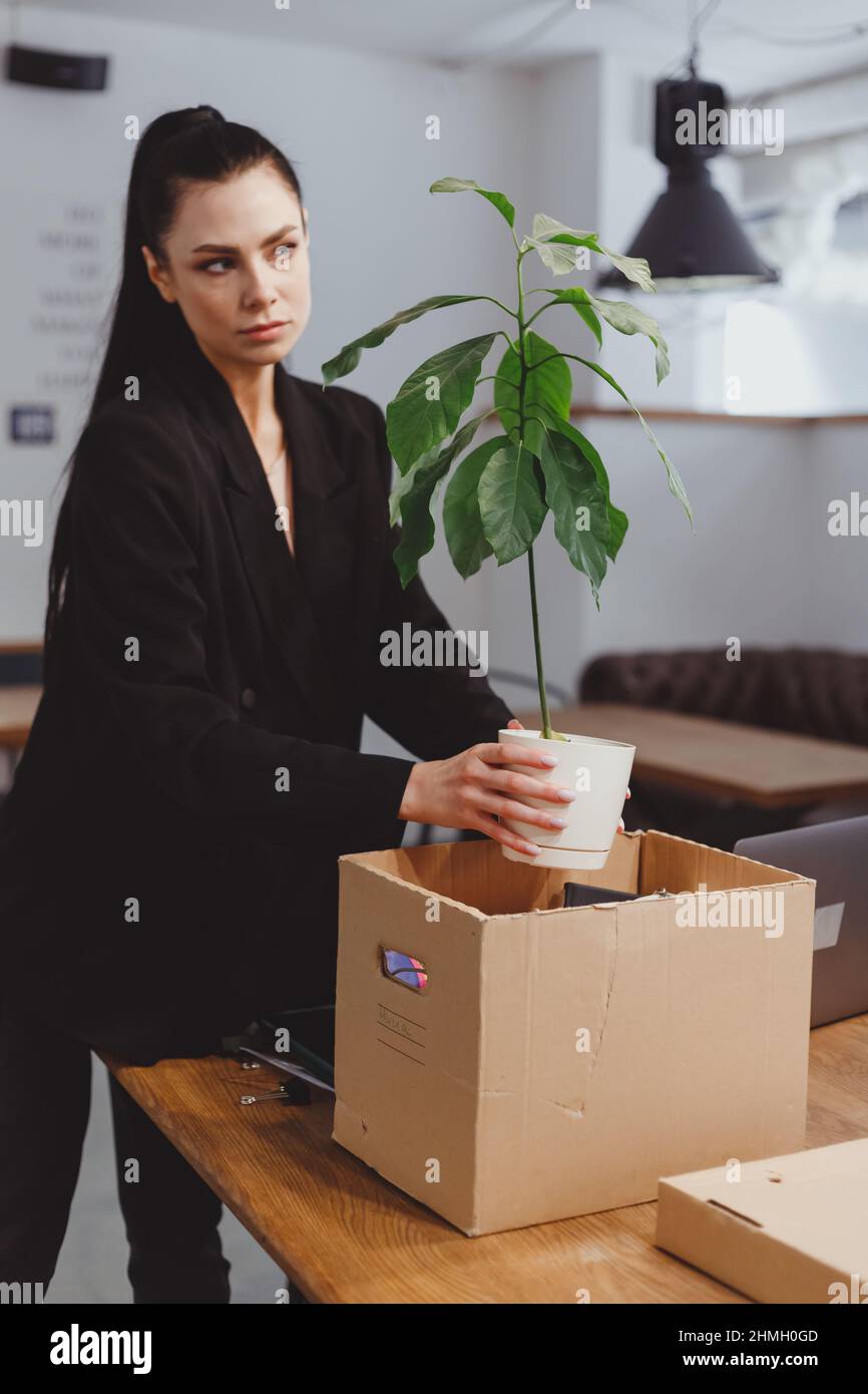 Dismissed woman packing personal hi-res stock photography and images ...