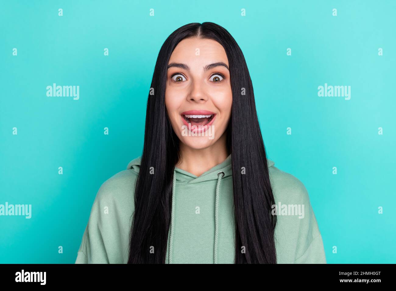 Photo Of Impressed Millennial Black Hairstyle Lady Wear Green Hoodie
