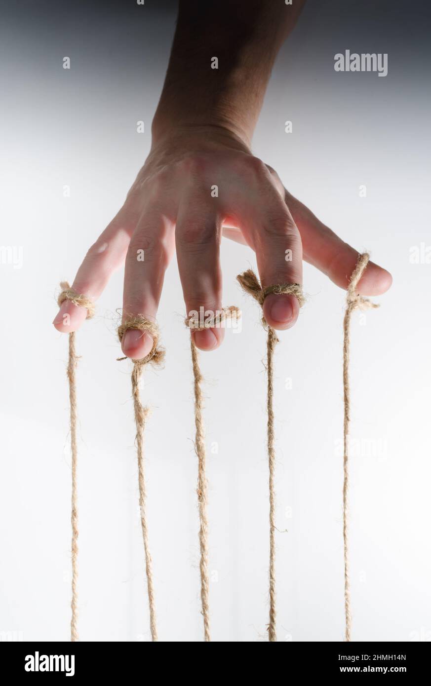 The human hand controls the puppet with the fingers attached to them ...