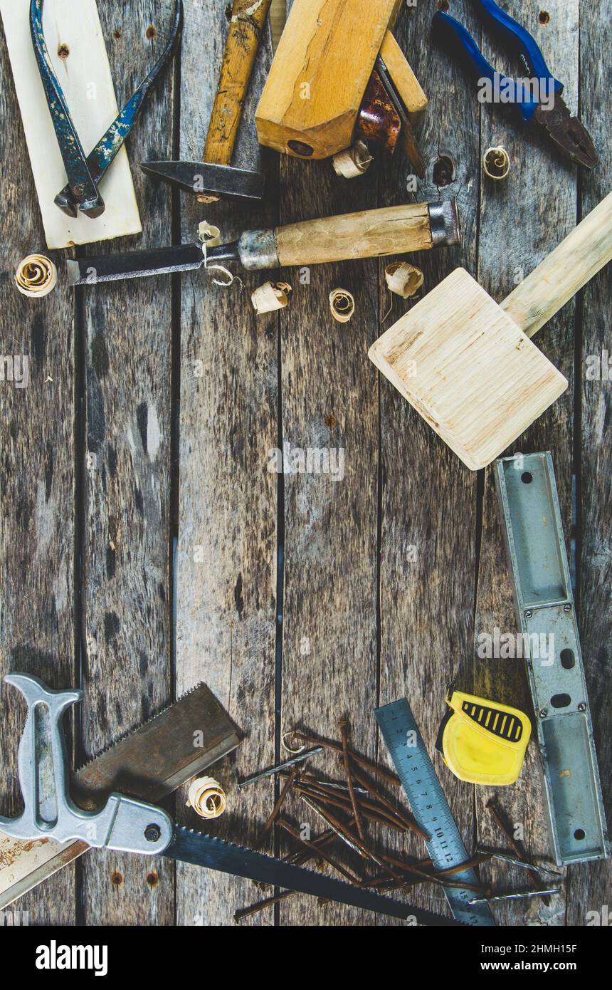 The carpenter tools on wooden bench, plane, chisel,mallet, tape measure ...