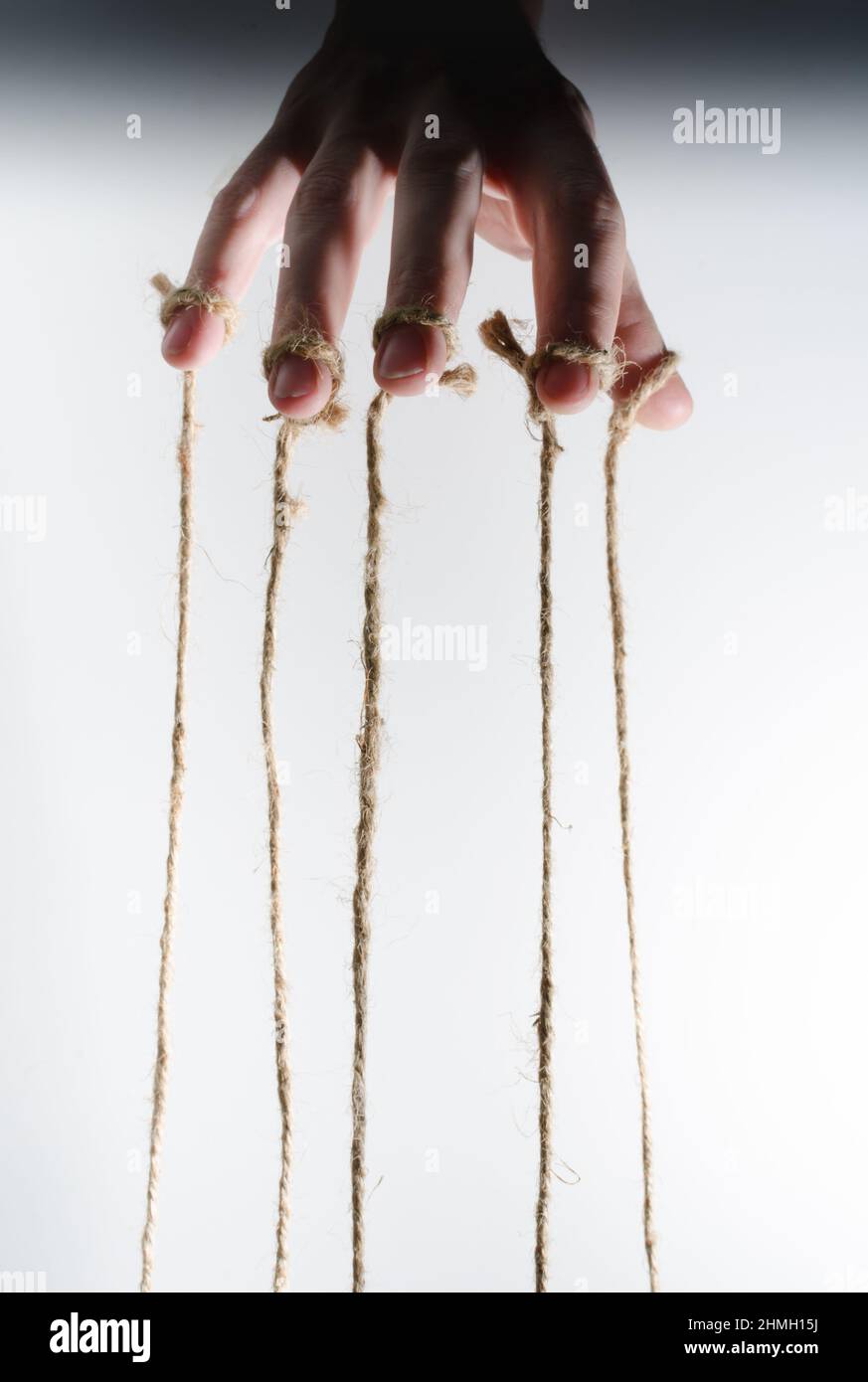 Controlled by threads hi-res stock photography and images - Alamy