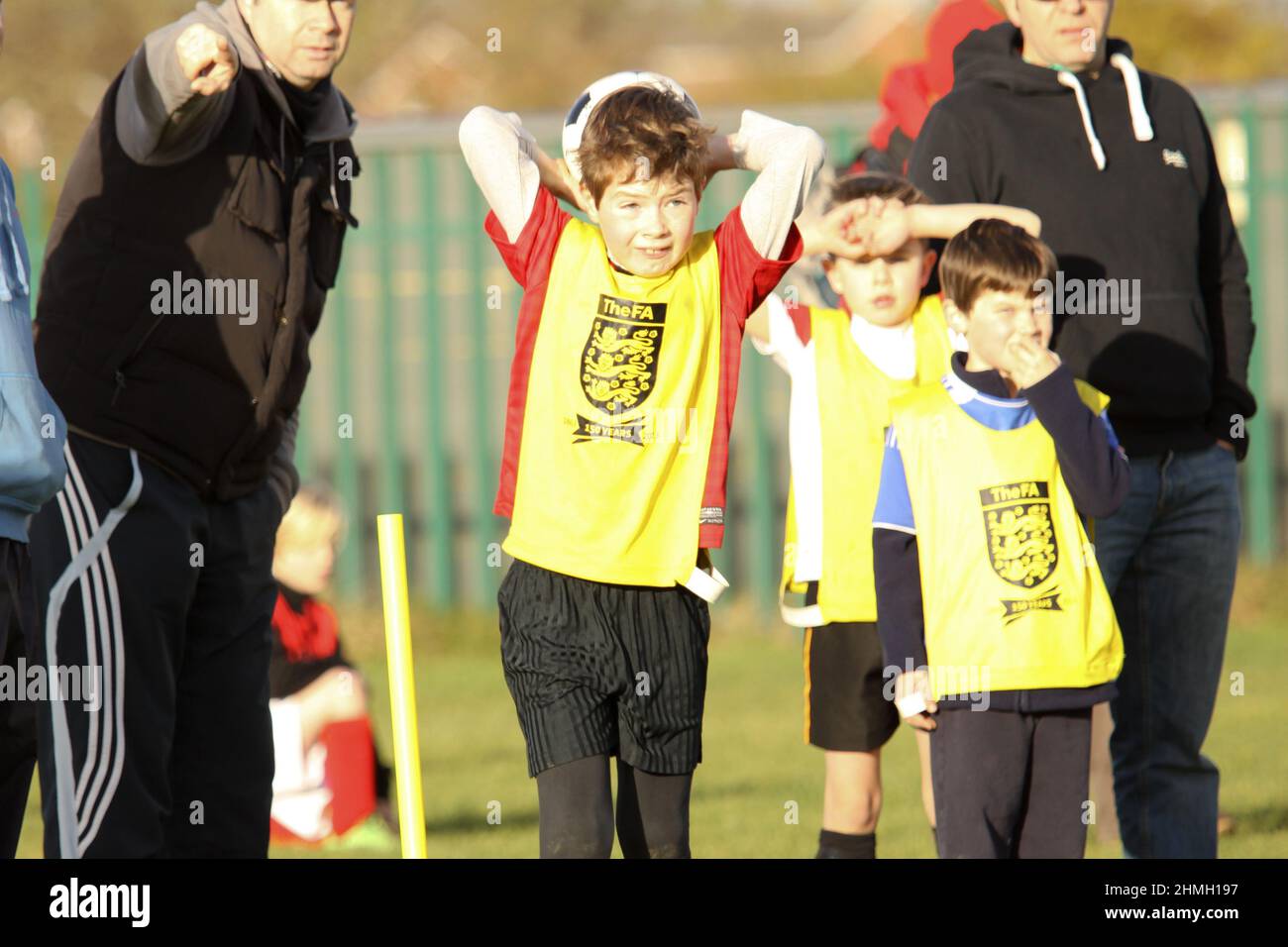 Primary school children playing football hi-res stock photography and ...