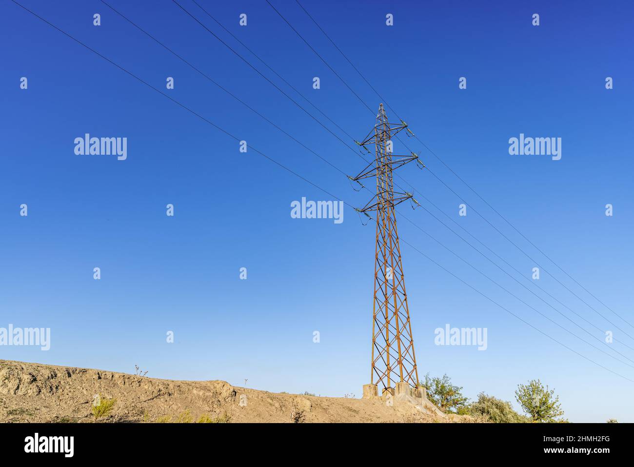 Electrical distribution network. High voltage pole. High voltage pylons ...