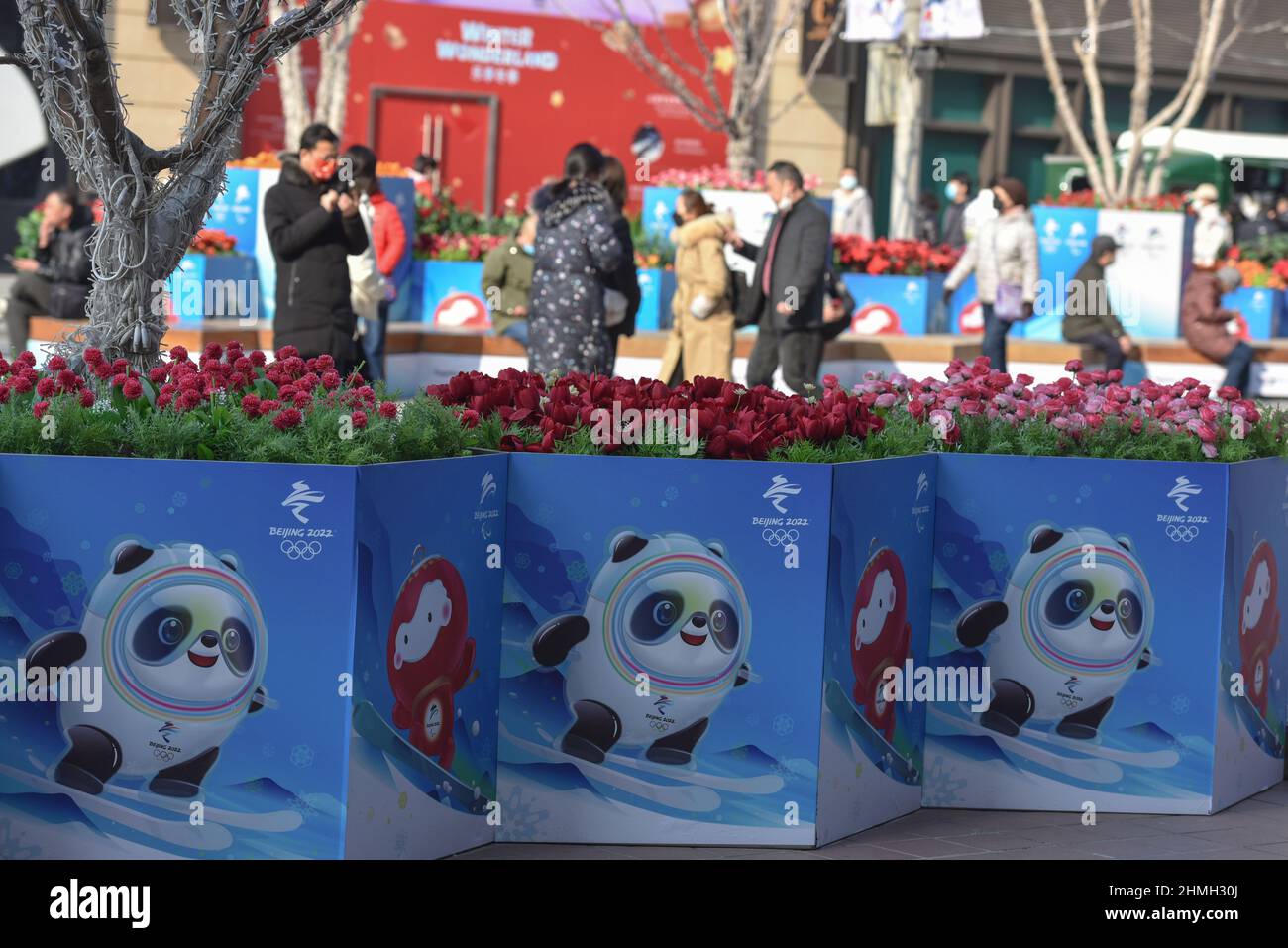 BEIJING, CHINA - FEBRUARY 10, 2022 - People walk past winter Olympic ...