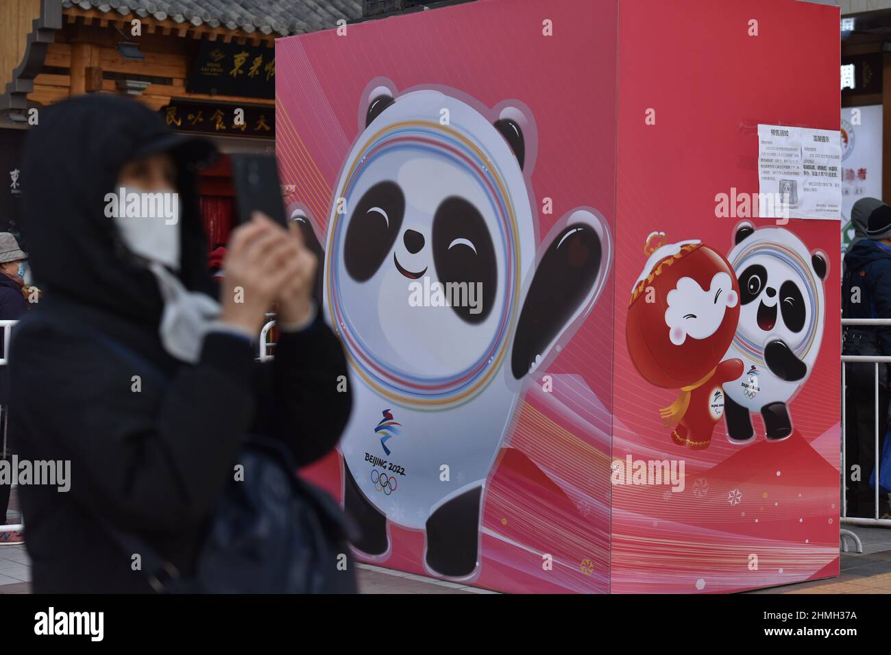 BEIJING, CHINA - FEBRUARY 10, 2022 - People walk past winter Olympic ...