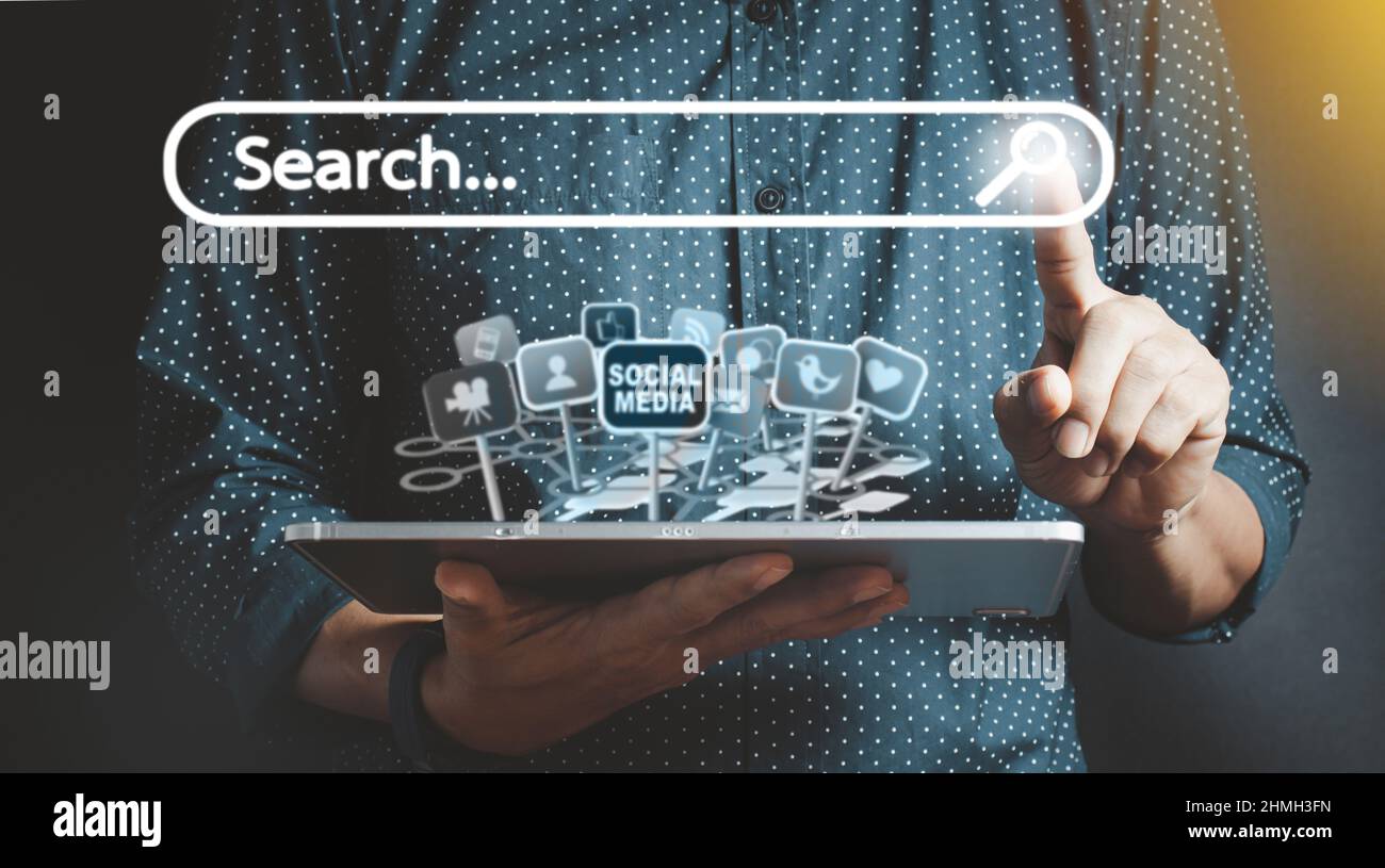 Businessman is touching a search bar on a virtual screen with his ...