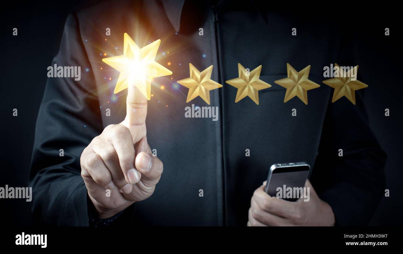 Hand of businessman touching five star symbol to increase rating of ...