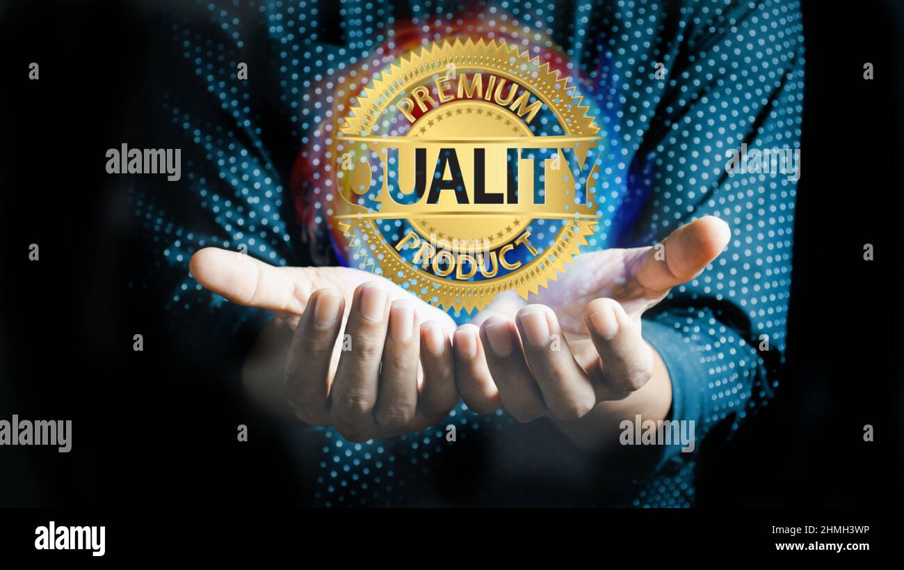Quality product symbol in the hand of a business man.Hand shows the ...