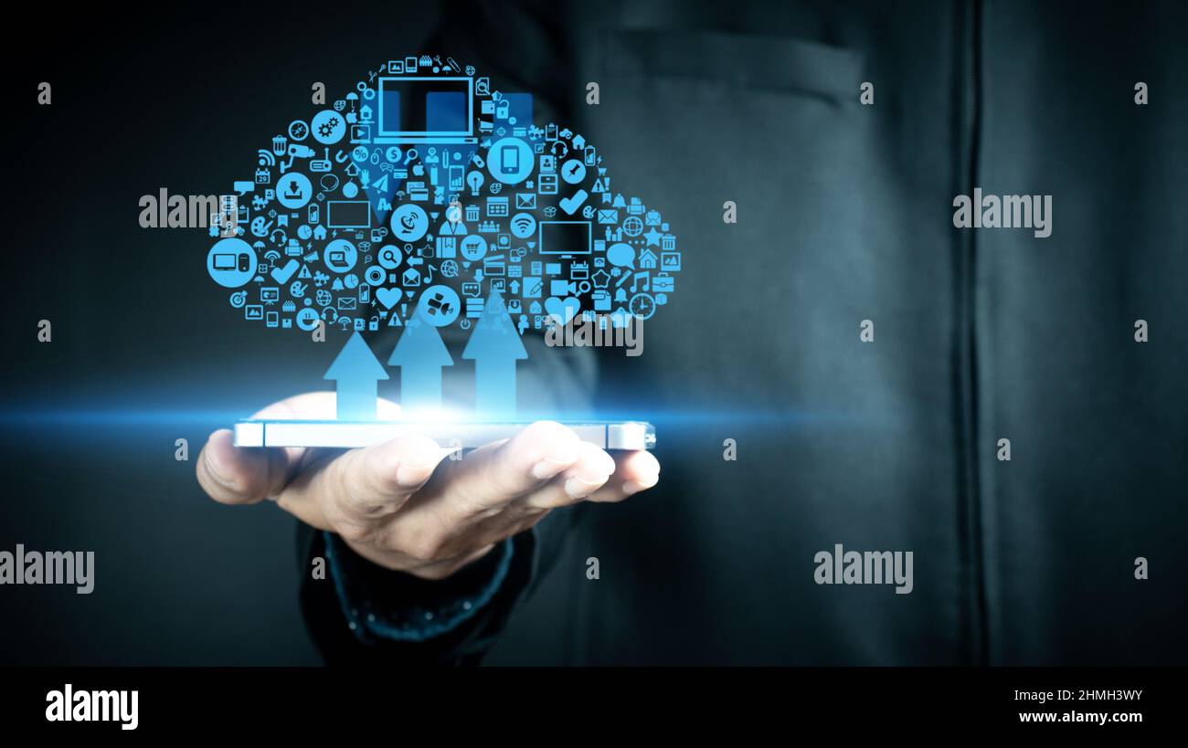 Business people hold mobile phones with virtual cloud computing, data transfer and cloud ...