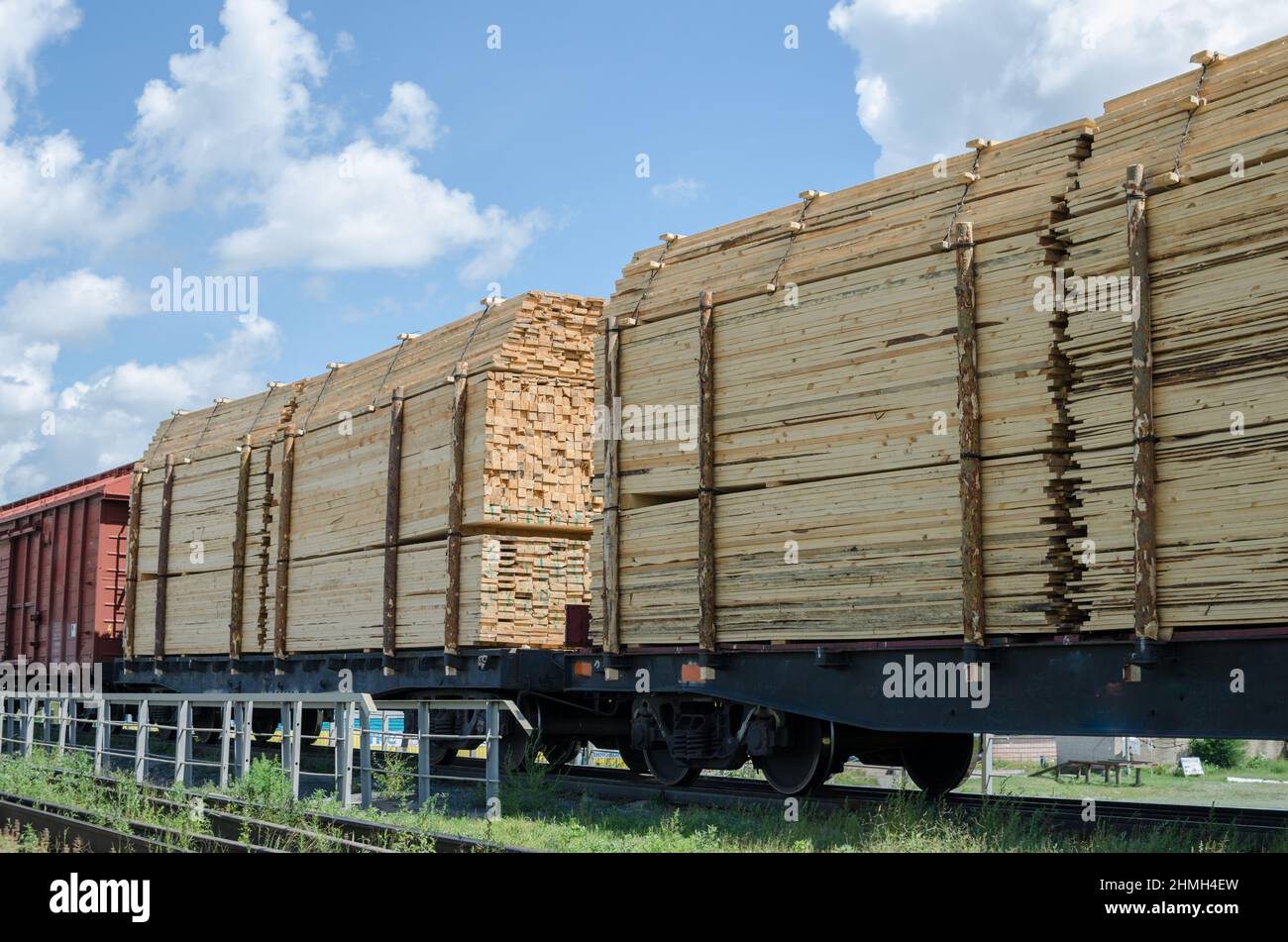 Full rail cars of timber against the sky Stock Photo - Alamy
