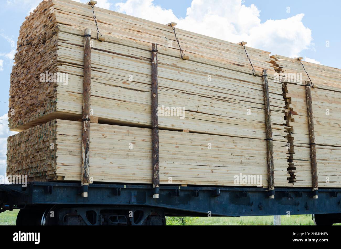 Full rail cars of timber against the sky Stock Photo - Alamy