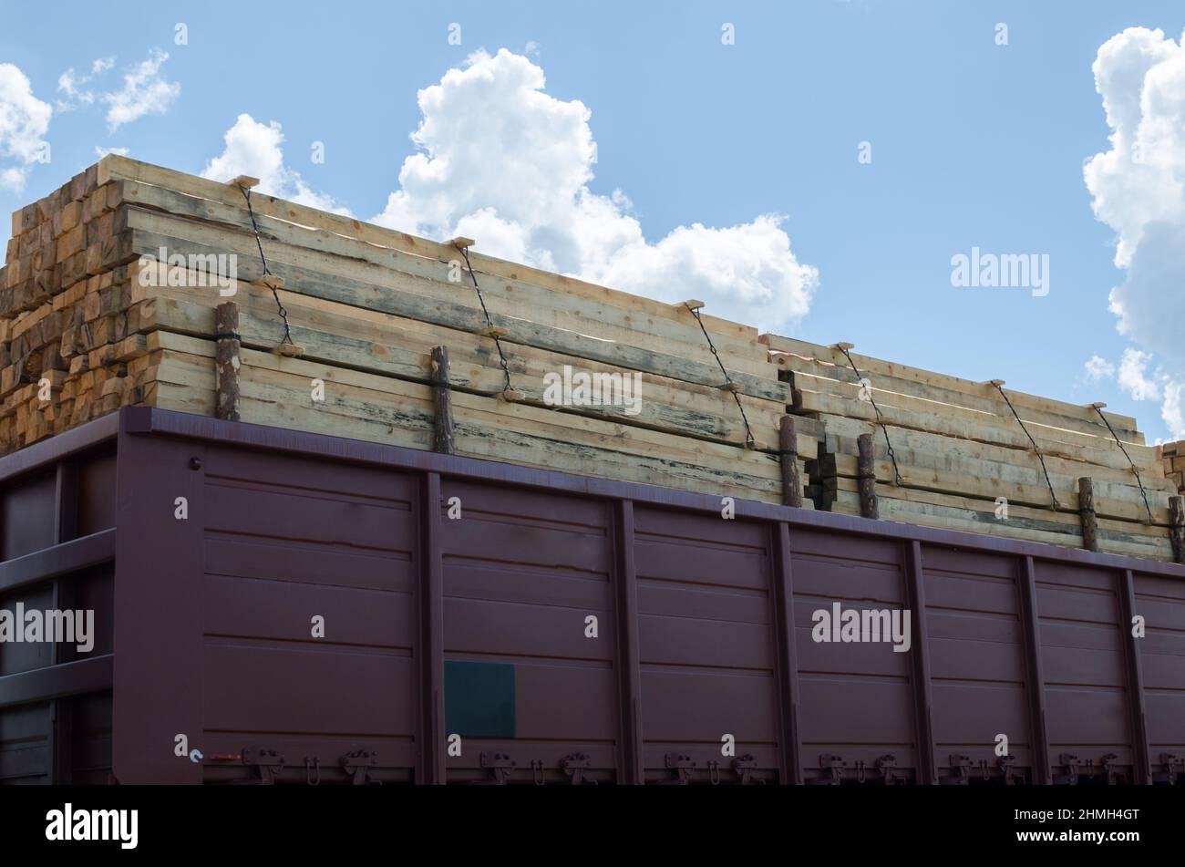 Full rail cars of timber against the sky Stock Photo - Alamy