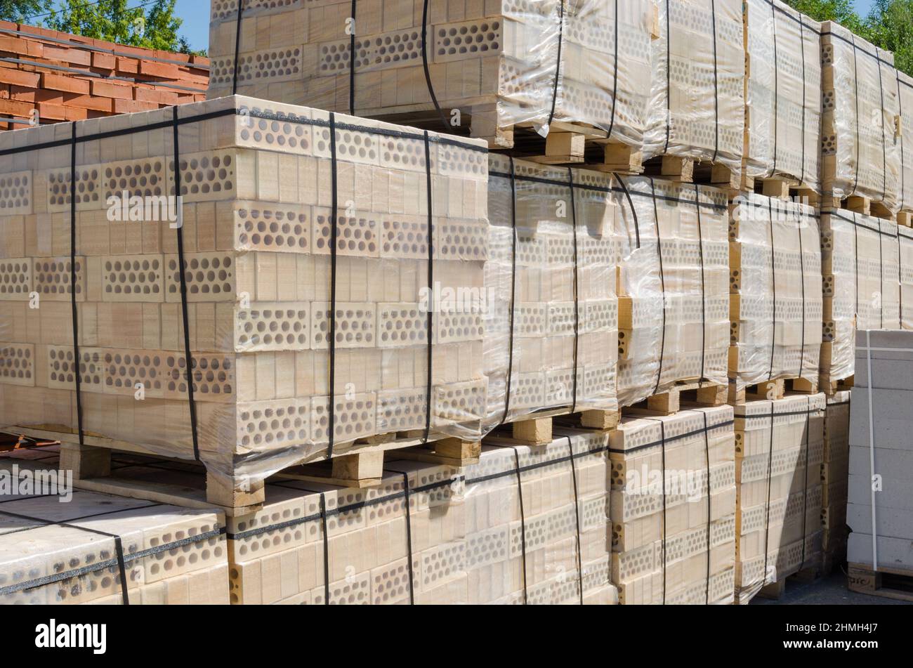 Large number of pallets of yellow brick Stock Photo - Alamy