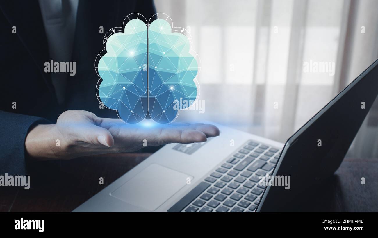 Businessman holding human brain on his hand with logistics symbols ...