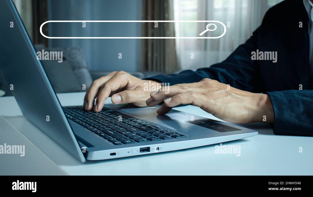 Data Search Technology Search Engine Optimization. man's hands are using a computer notebook to ...