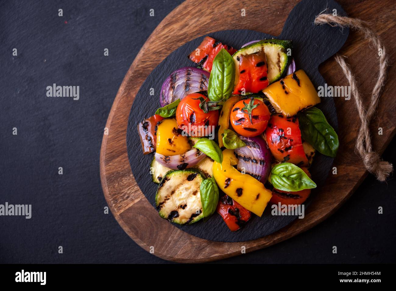 Roasted cooked assorted vegetables with herbs and spices Stock Photo ...