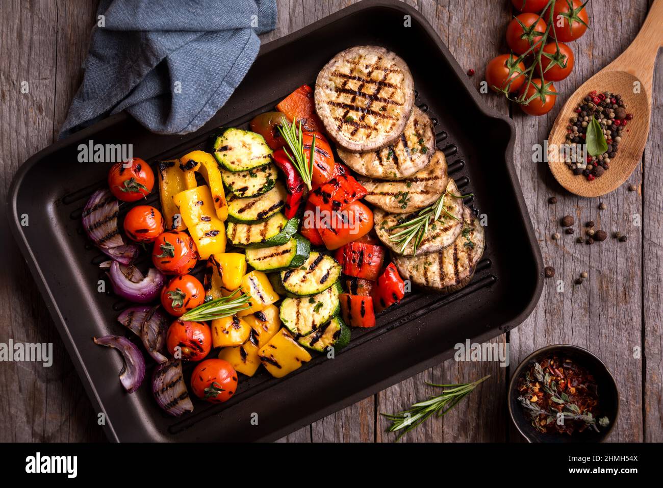 Roasted cooked assorted vegetables with herbs and spices Stock Photo ...