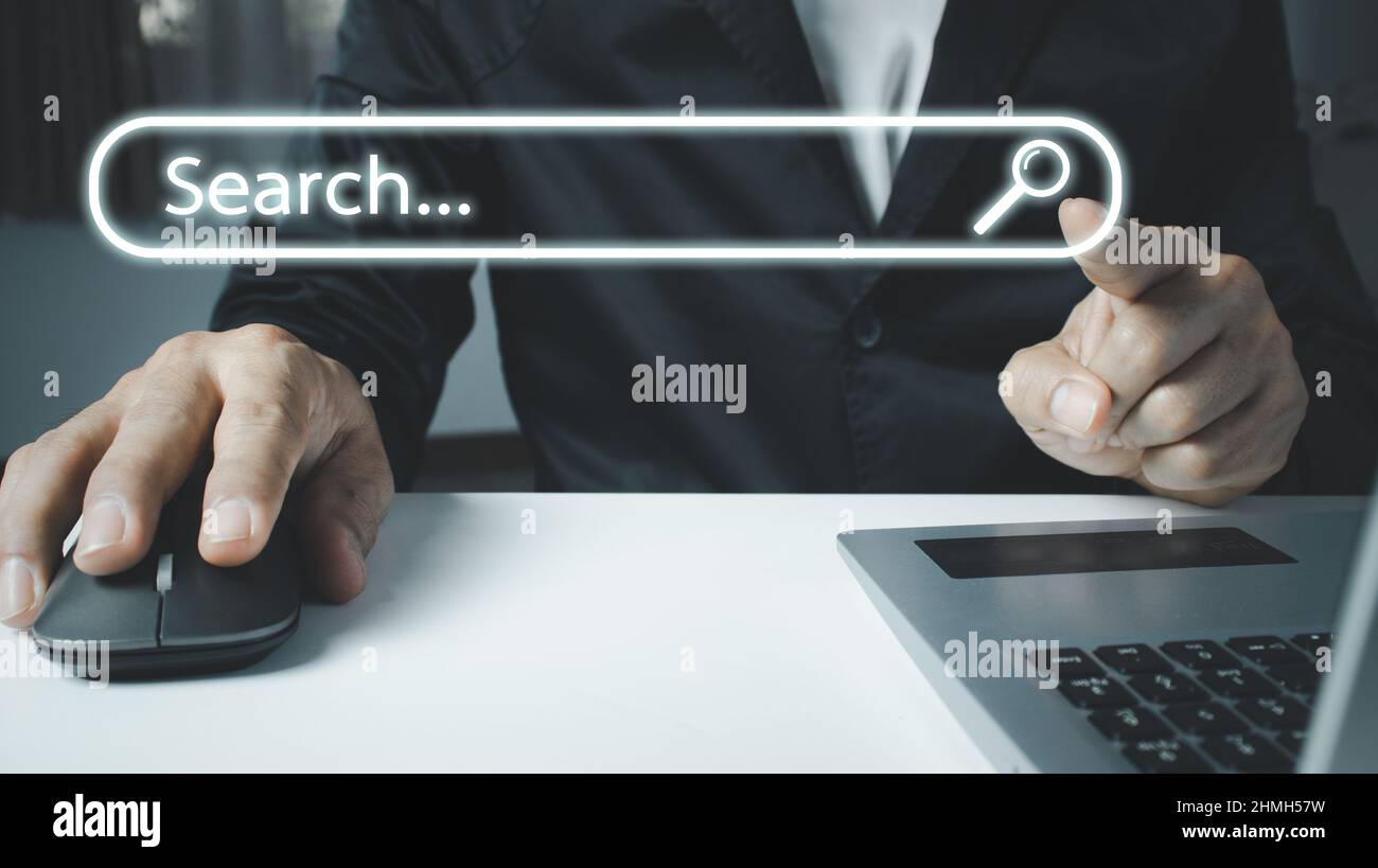 Data Search Technology Search Engine Optimization. man's hands are using a computer notebook to ...