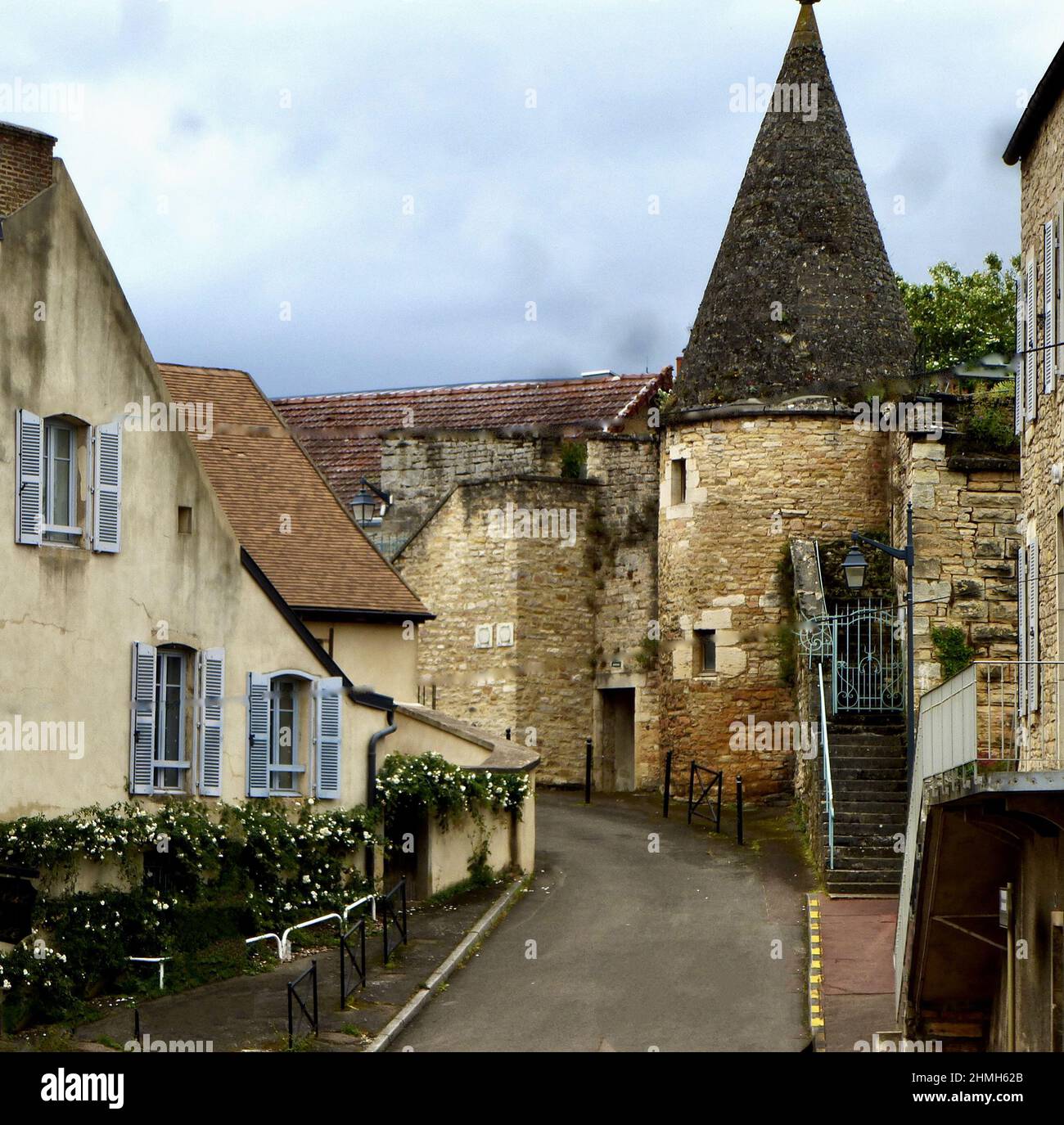 Beautiful view of the small castle building on a gloomy day in Beaune ...