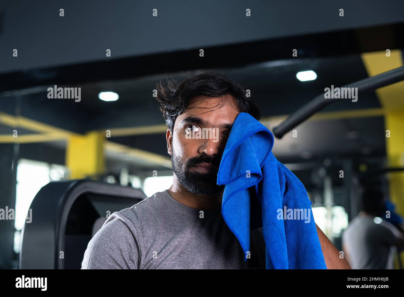 close up head shot of Hard working Indian young bodybuilder relaxing by ...