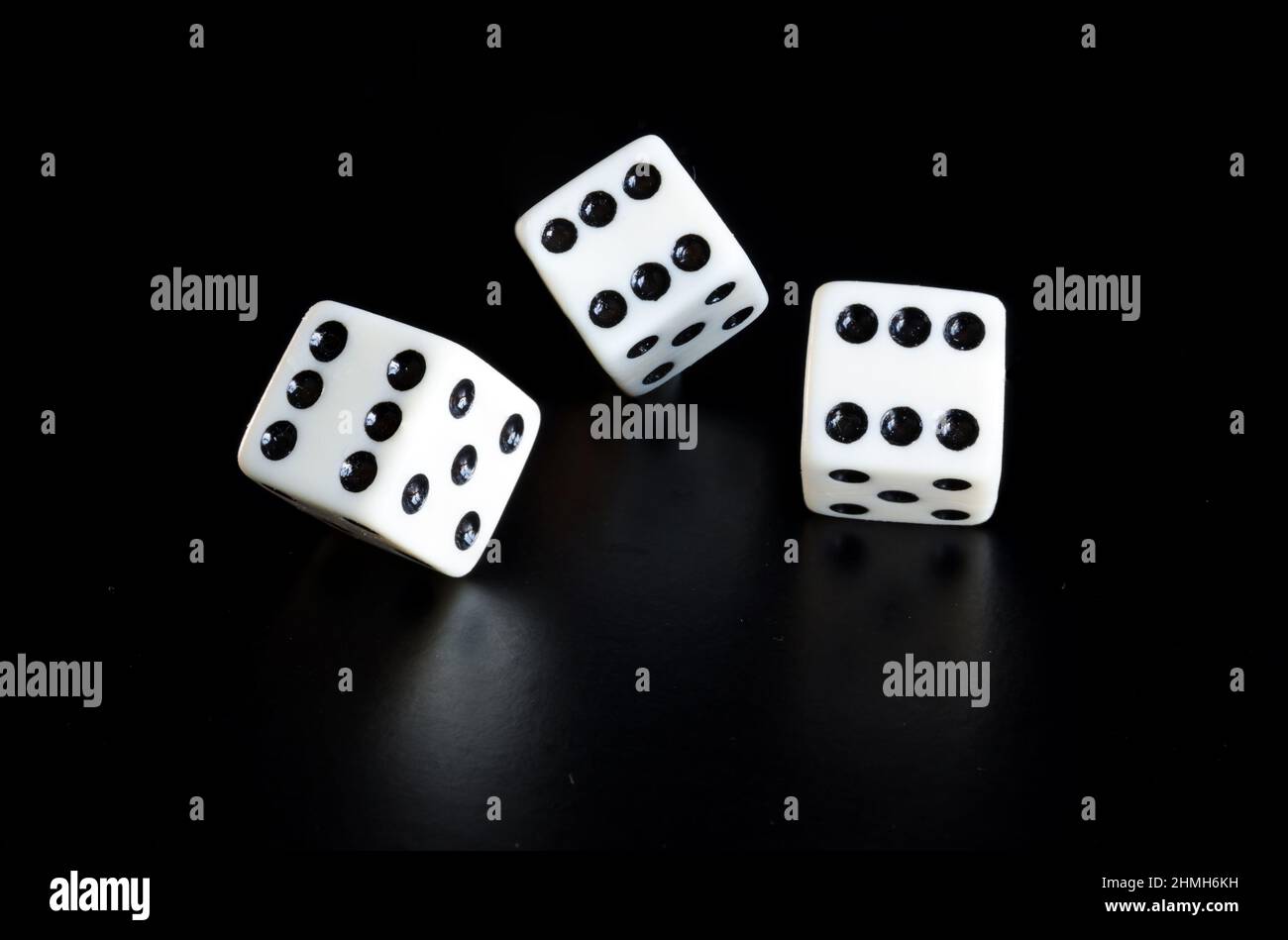 Thrown the dice on black background with reflection Stock Photo - Alamy