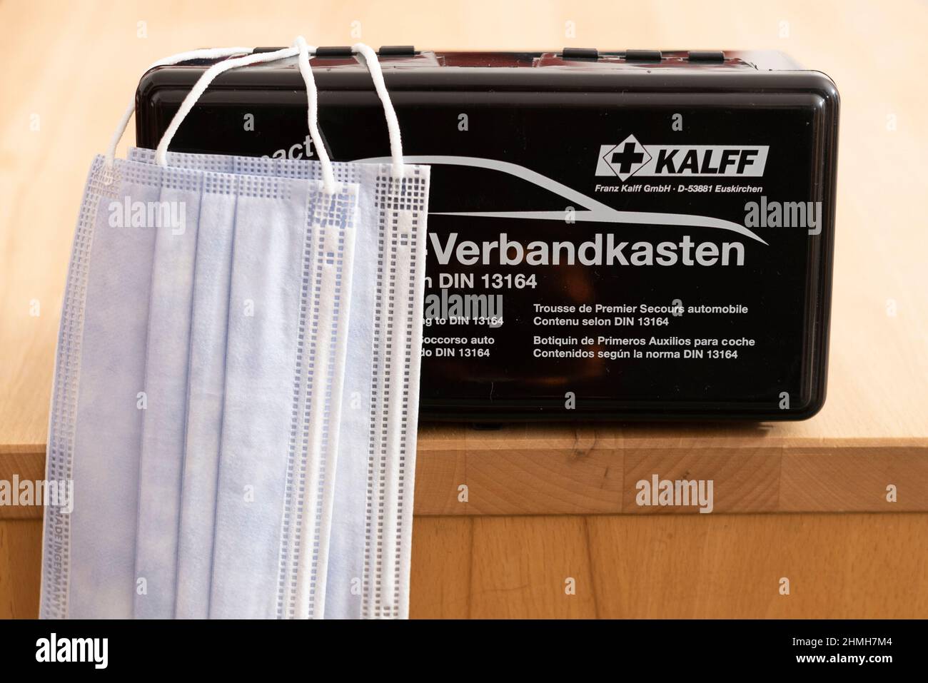 First aid kit, two medical masks Stock Photo - Alamy